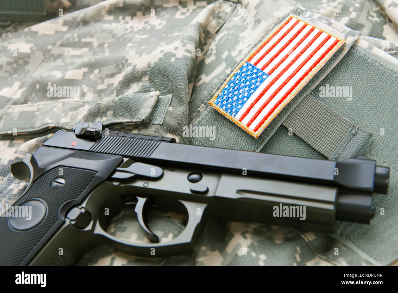 Handgun on solder's uniform - studio shot Stock Photo - Alamy