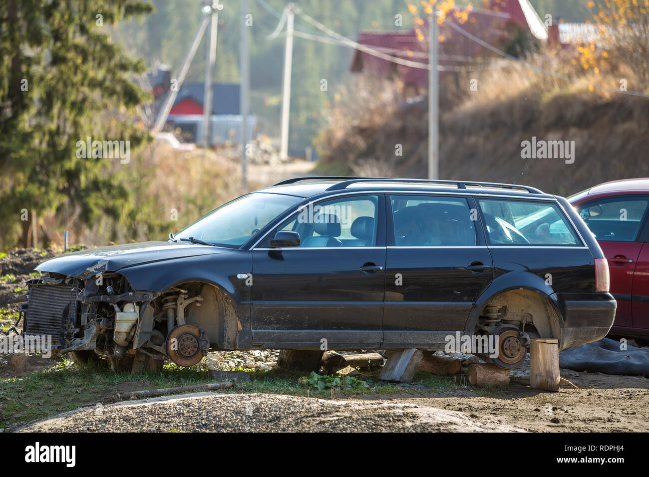 Old forsaken rusty broken trash car after crash accident without wheels ...