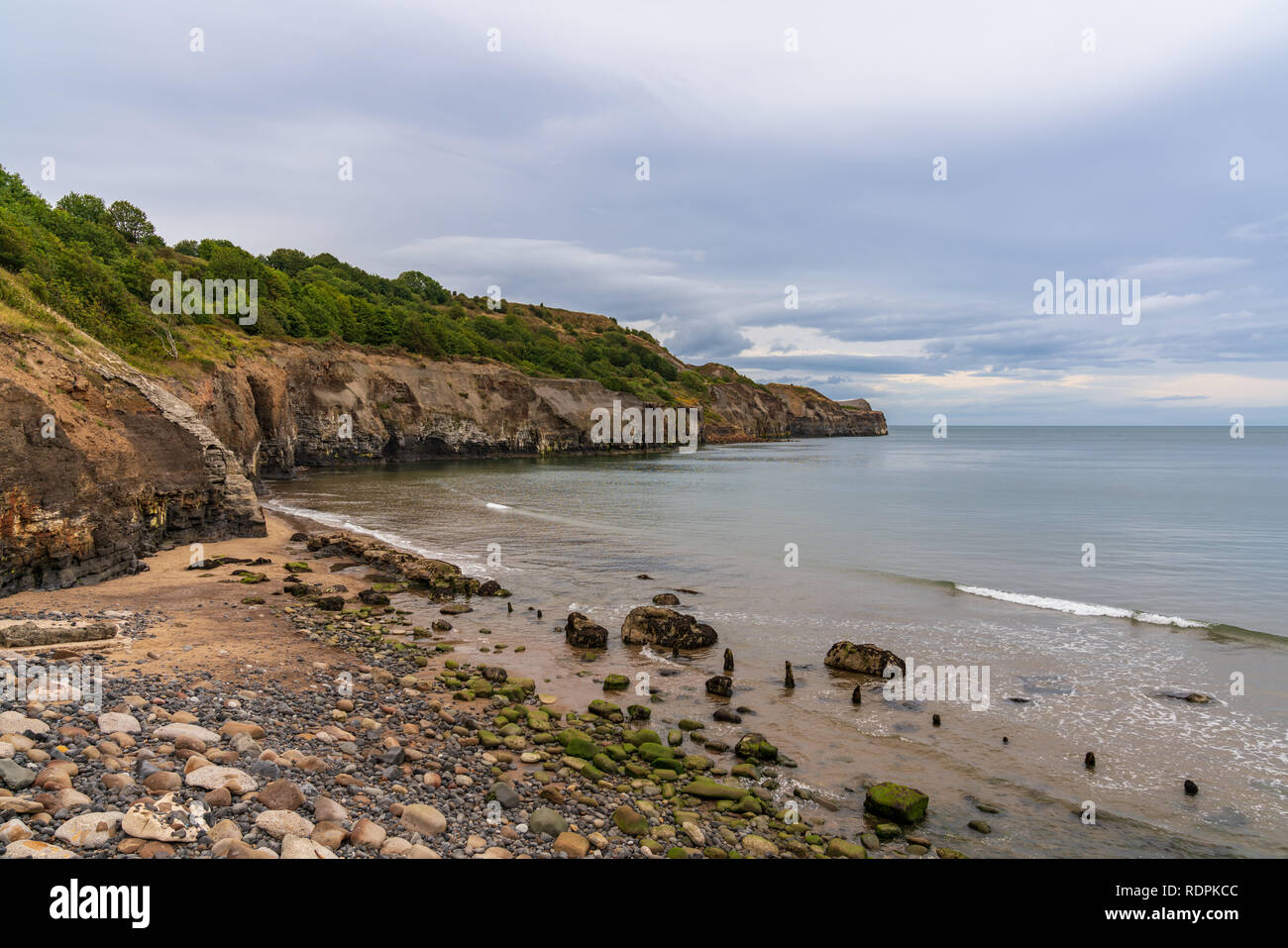 Beach and cliffs in Sandsend, North Yorkshire, England, UK Stock Photo ...
