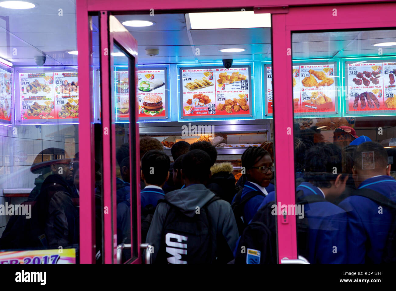 London, UK. 18th January 2019. School children after school in a fast ...