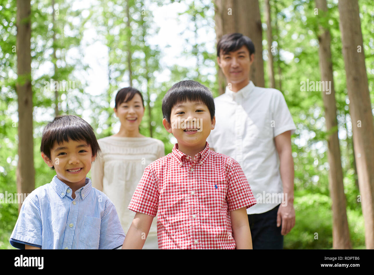 Japanese family in a city park Stock Photo - Alamy