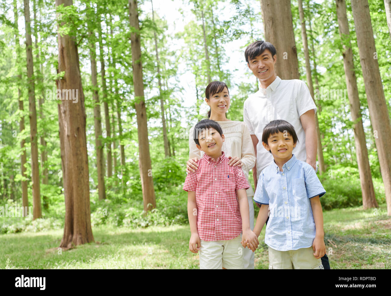 Japanese family in a city park Stock Photo - Alamy