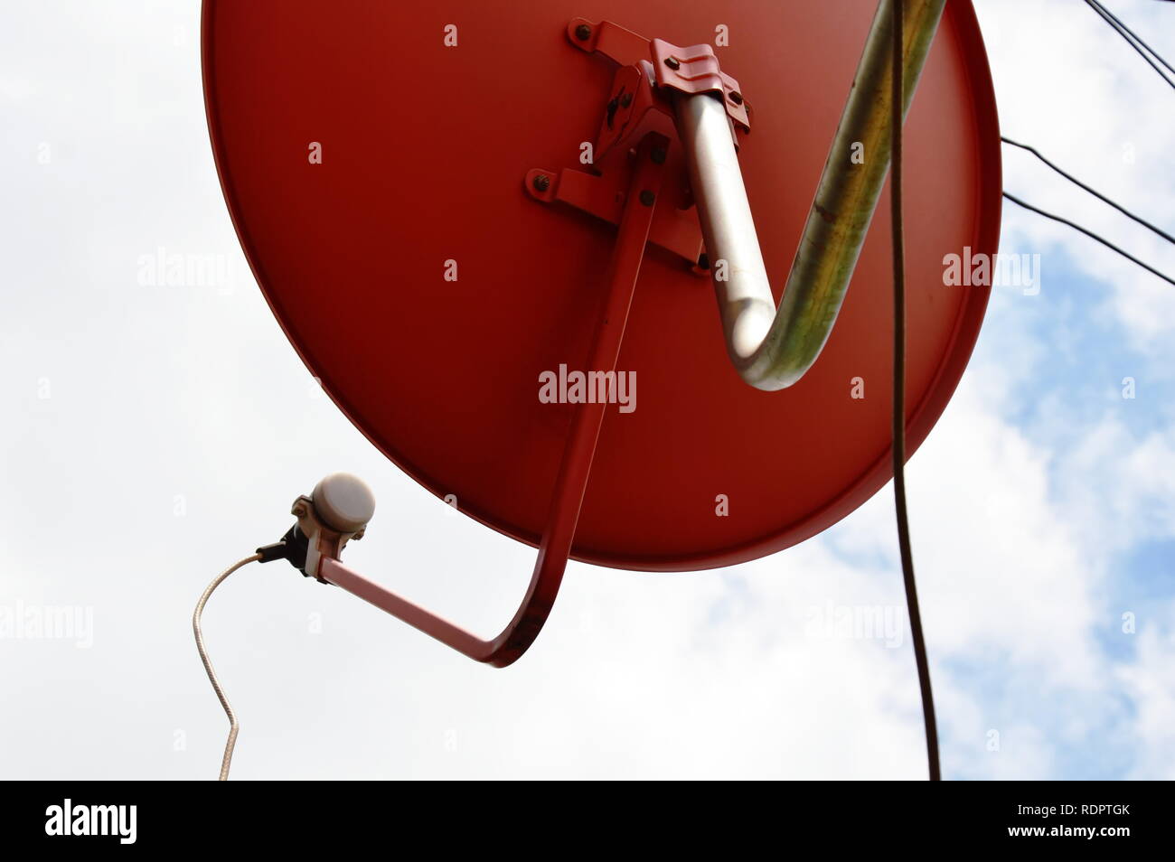 red satellite dish and sky background Stock Photo - Alamy