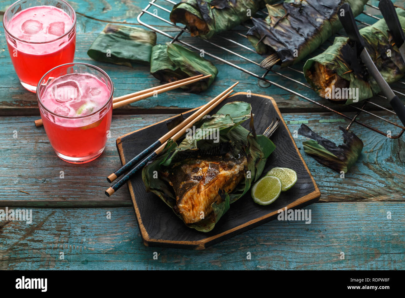 Grilled stingray wing or sambal stingray in leaf with lime and spicy ...