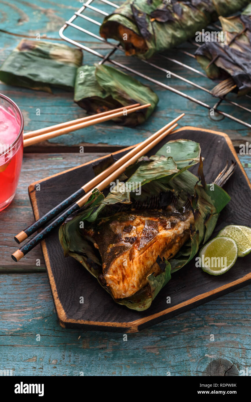 Grilled stingray wing or sambal stingray in leaf with lime and spicy ...