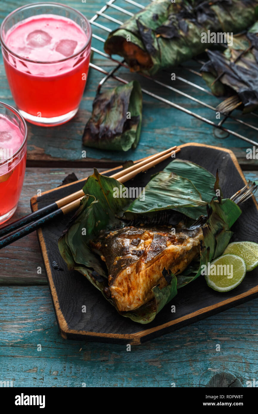 Grilled stingray wing or sambal stingray in leaf with lime and spicy ...