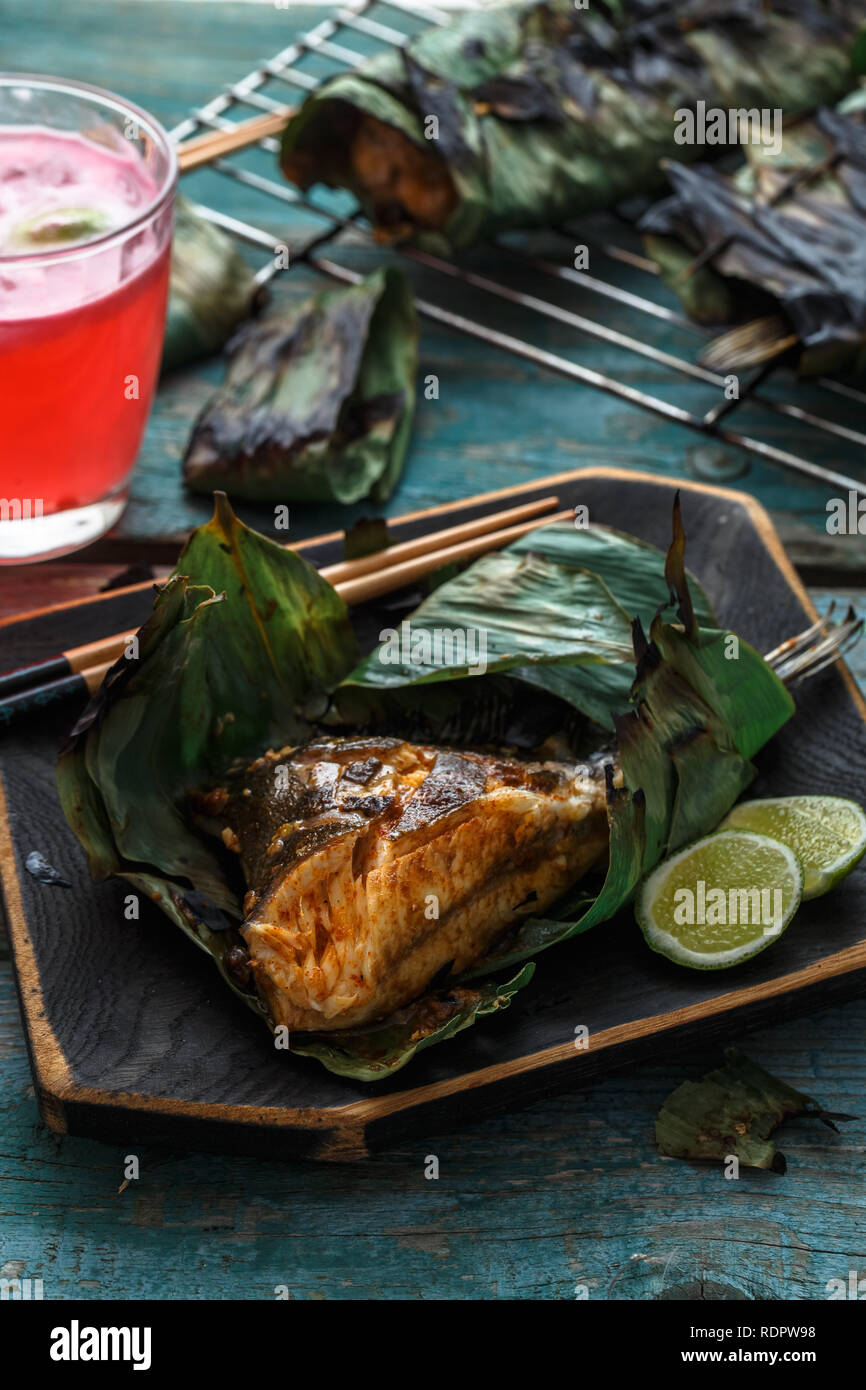 Grilled stingray wing or sambal stingray in leaf with lime and spicy ...