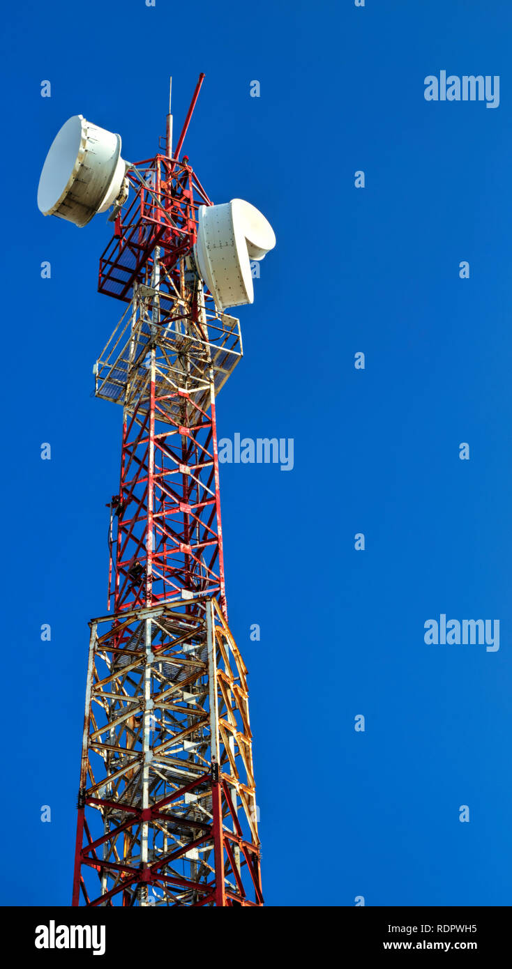 Communication antenna tower on blue sky Stock Photo - Alamy