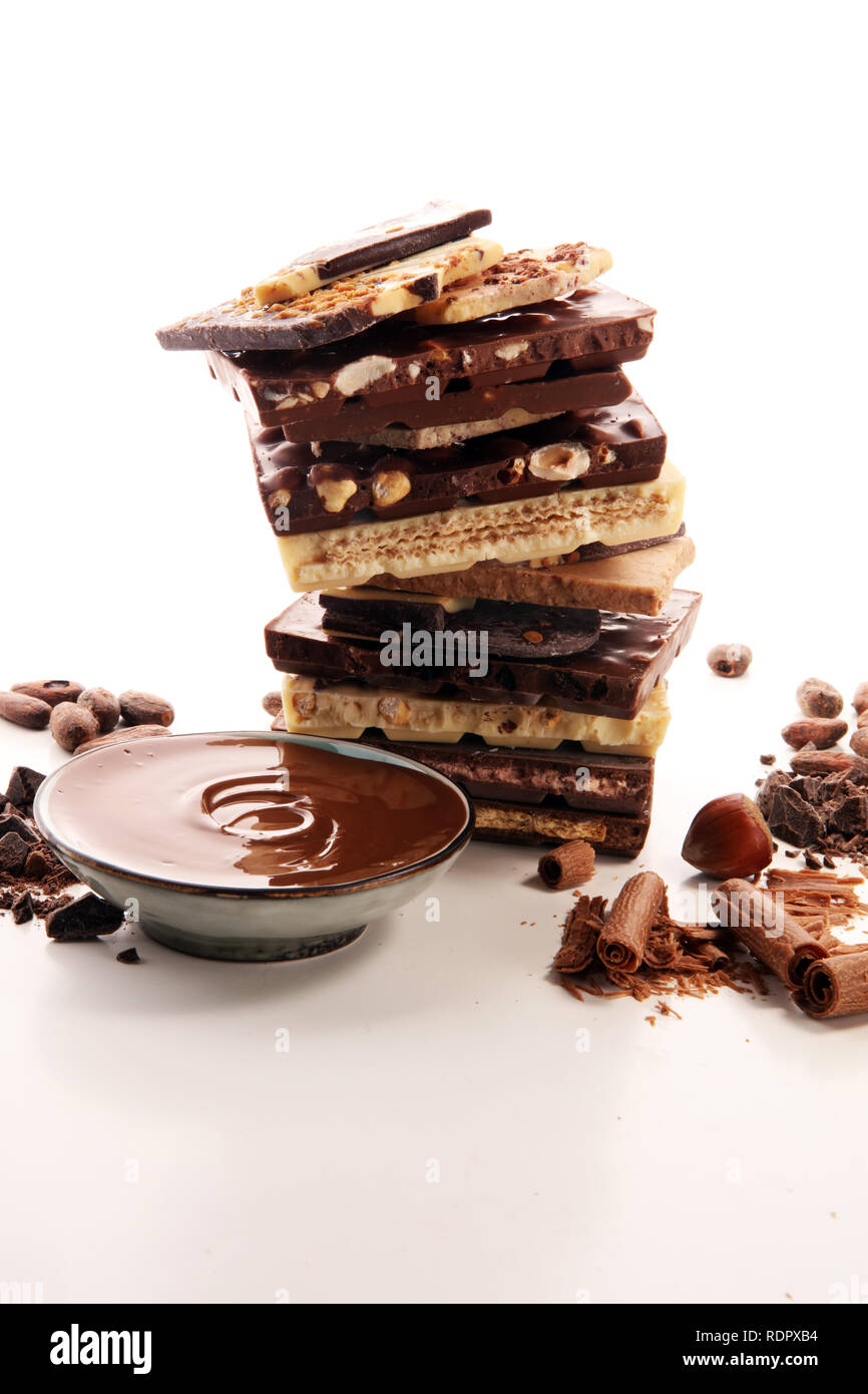 Chocolate bars on table with chocolate tower. Chocolate and nuts and ...