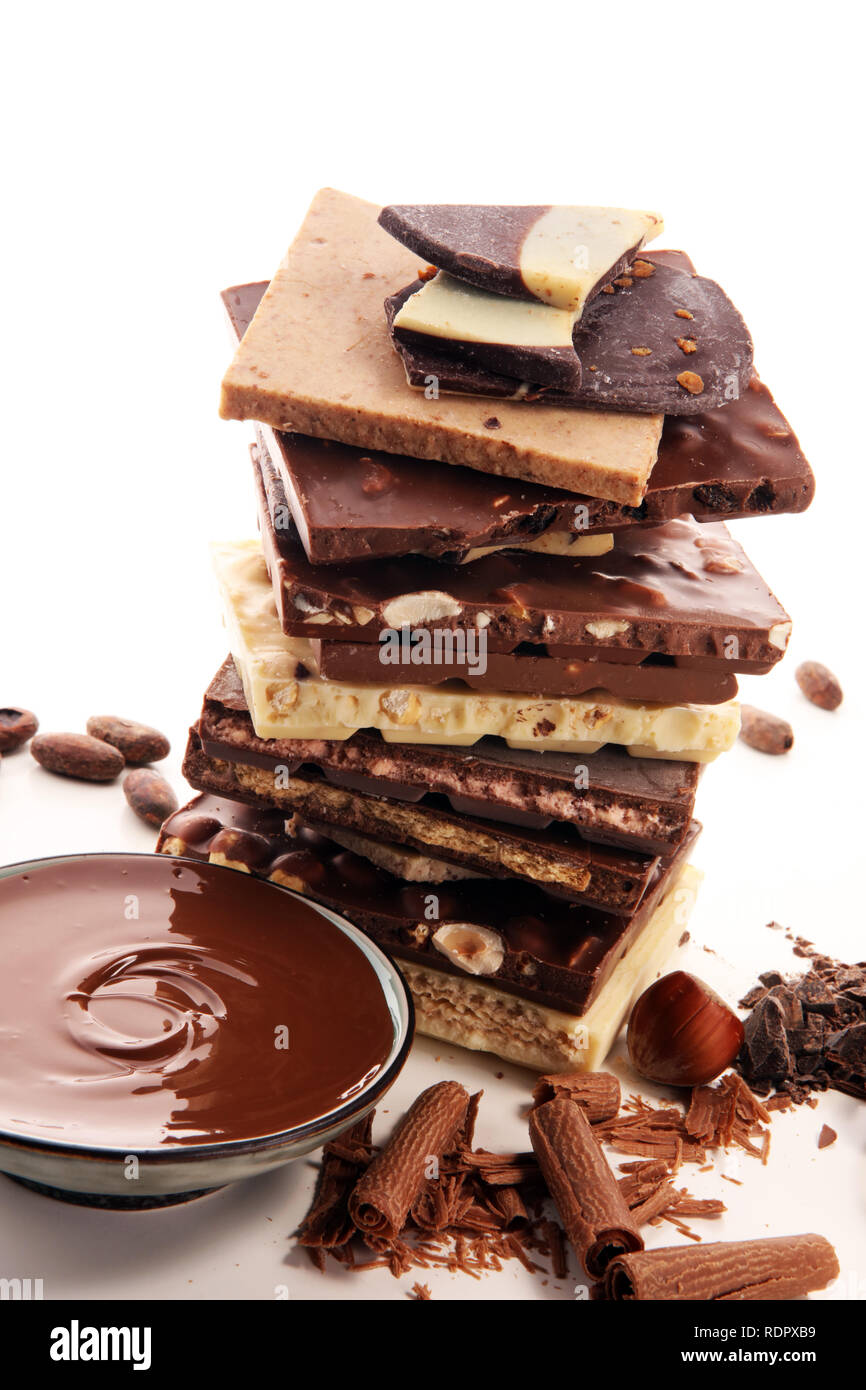 Chocolate bars on table with chocolate tower. Chocolate and nuts and ...