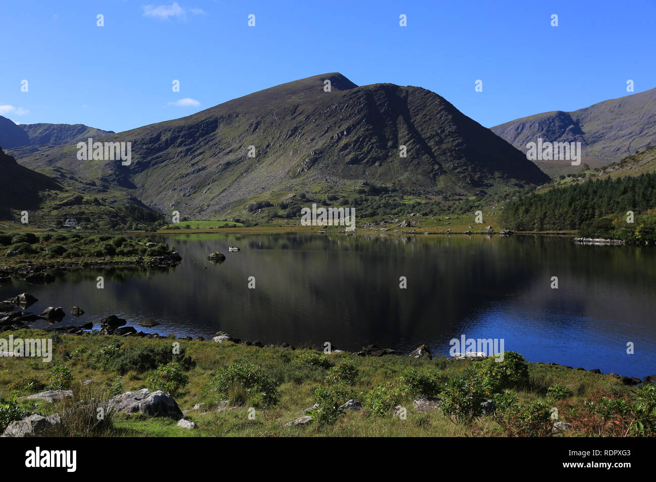 small fresh water lake hidden under irelands highest mountain, black ...