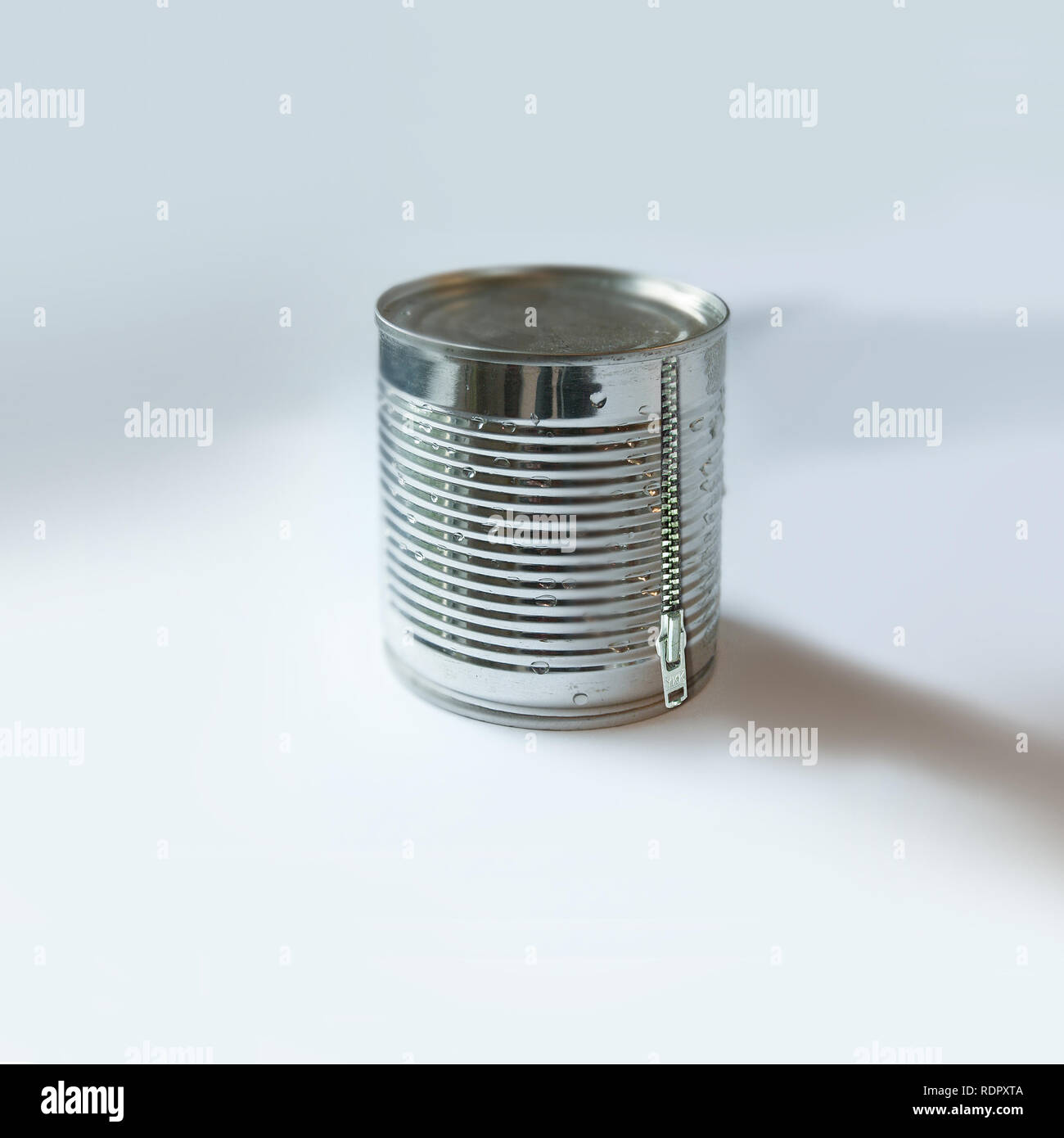 Opening a tin with a zipper Stock Photo - Alamy