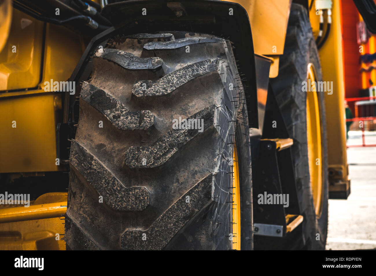 The hydraulic tractor is yellow. Crawler bulldozer at the exhibition ...