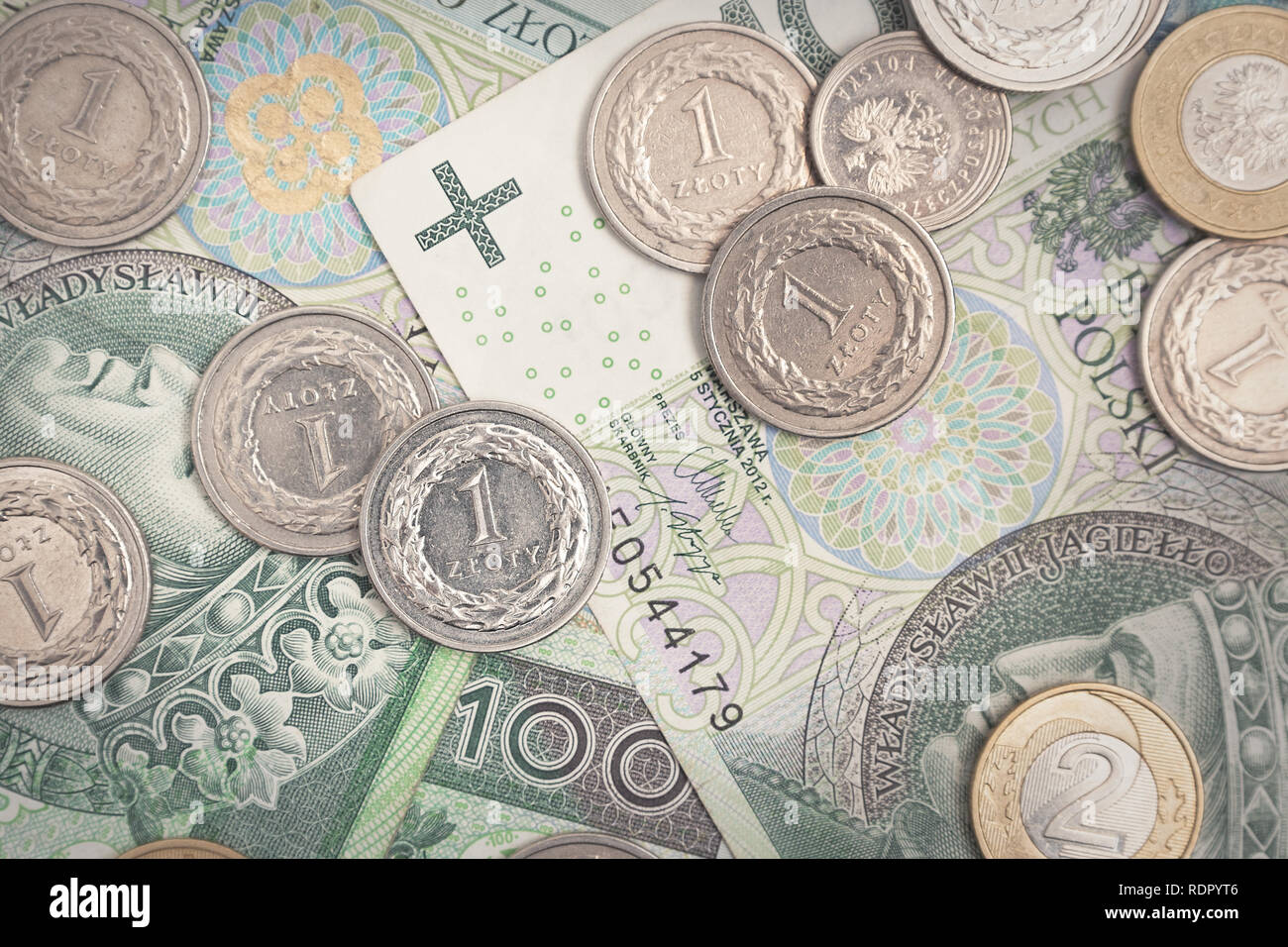 Polish currency, stack of polish banknotes and coins. Top view ...