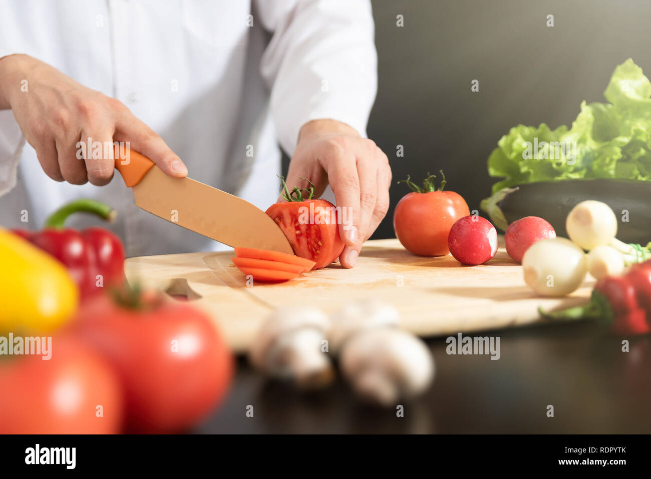 Chef prepares fresh vegetables. Cooking, healthy nutrition concept ...
