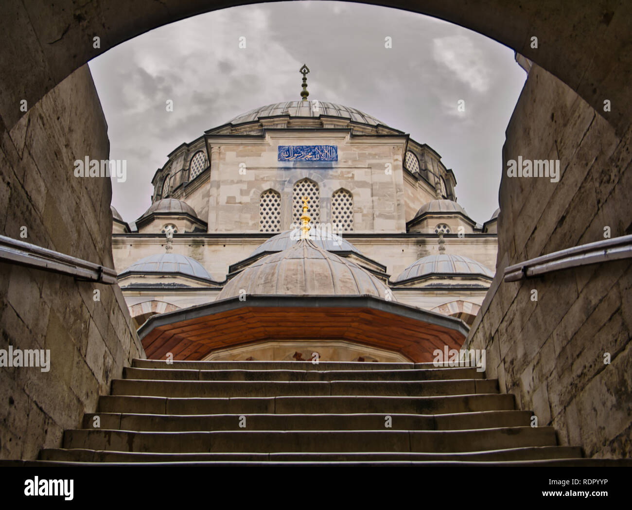 Vaulted entrance with an old stone staircase to a mosque in Istanbul ...