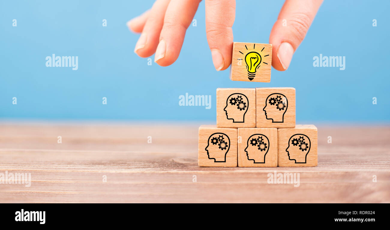 hand placing blocks on top of each other. ideao concept with teamwork ...