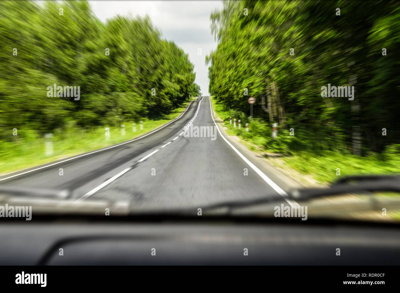 Moving forward road through trees hi-res stock photography and images ...