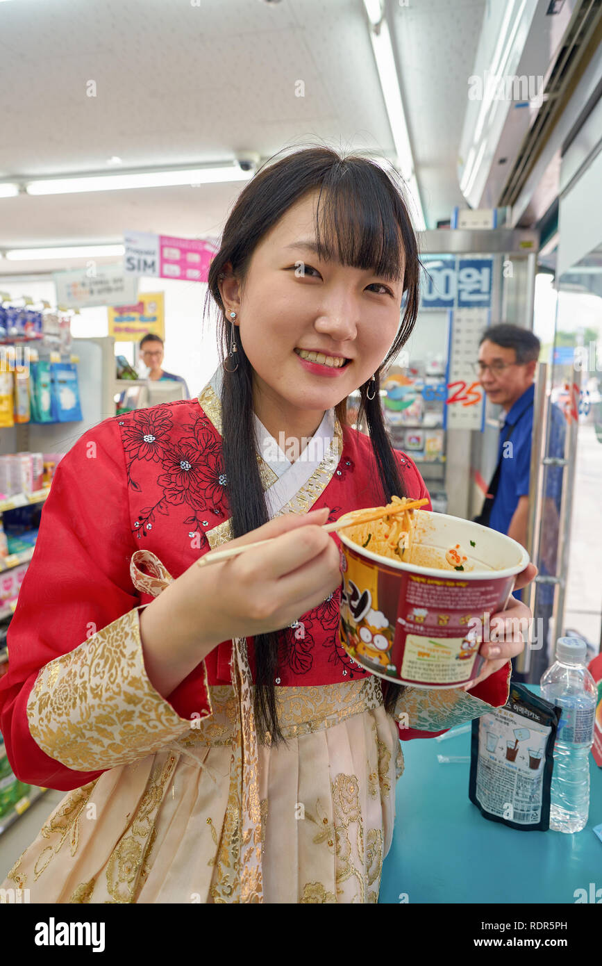 SEOUL, SOUTH KOREA - CIRCA MAY, 2017: woman at GS25 convenience store in Seoul. GS25 is a ...