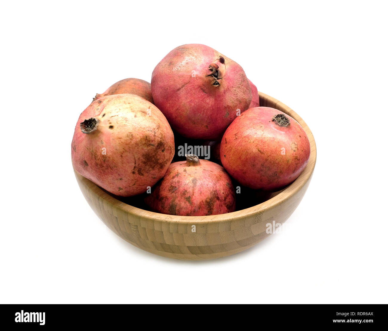Big round brown bowl full ob ripe whole pomegranates studio shot ...