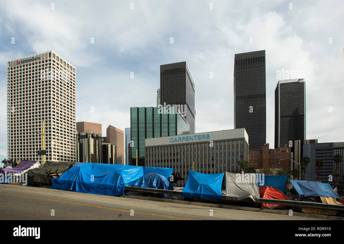 A homeless encampment next to the 110 Freeway, downtown Los Angeles ...