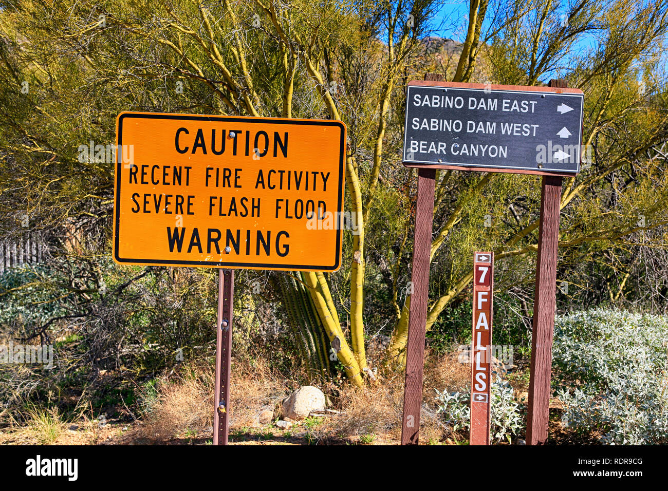 Caution sign severe flash flood warning and direction sign in the ...