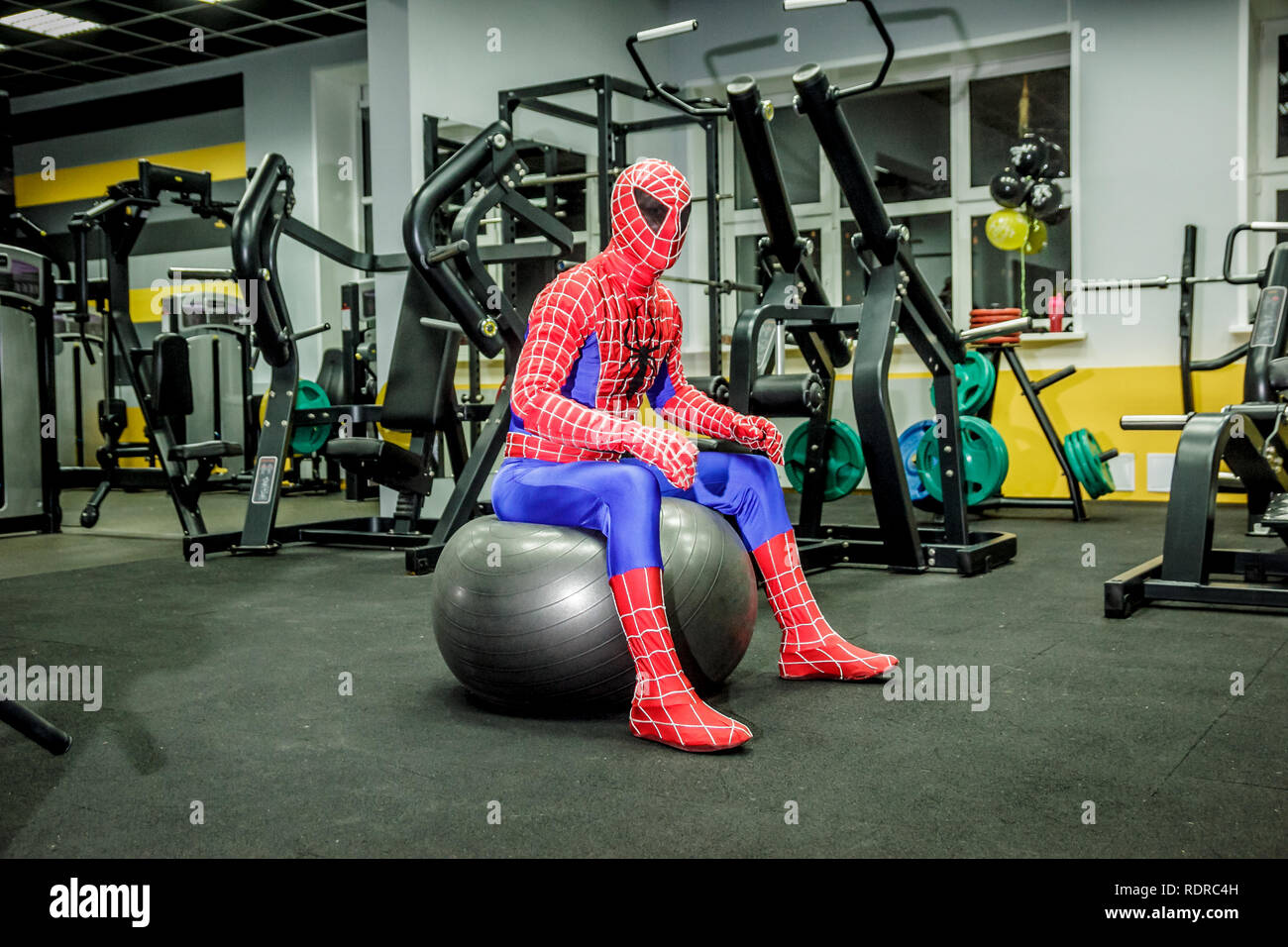 Animators iron man and spider-man in the fitness room at a corporate ...