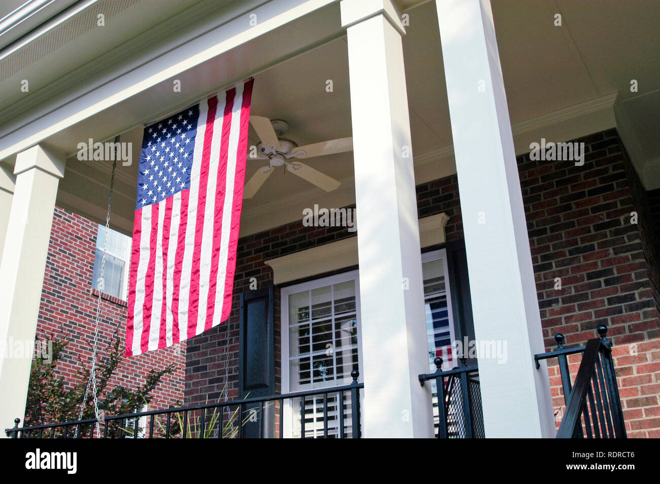 Front Porch with an American Flag Stock Photo - Alamy