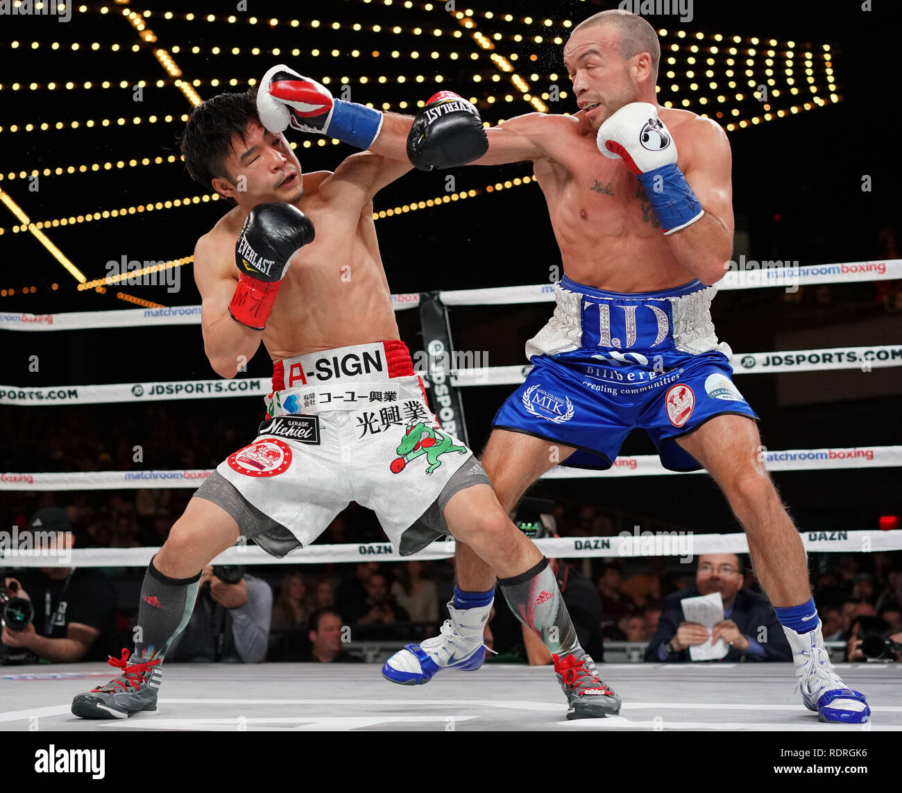 New York, New York, USA. 18th Jan, 2019. TJ DOHENY (blue trunks ...