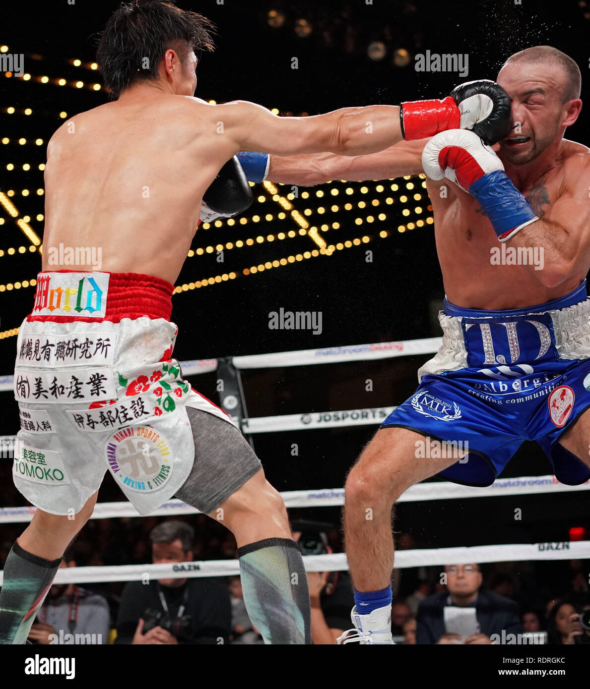 New York, New York, USA. 18th Jan, 2019. TJ DOHENY (blue trunks ...