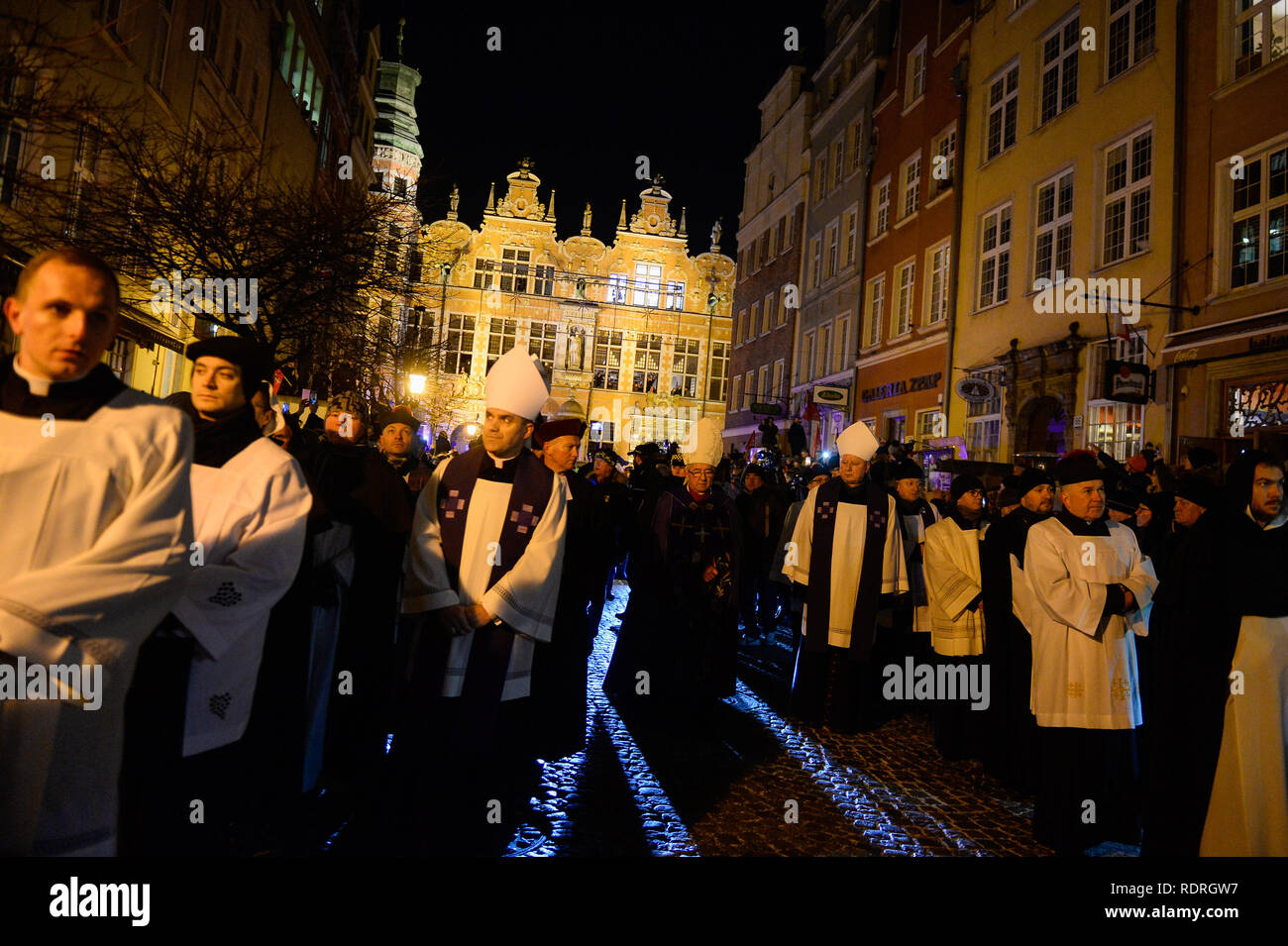 Members of the Catholic Church seen carrying a cross and candles during ...