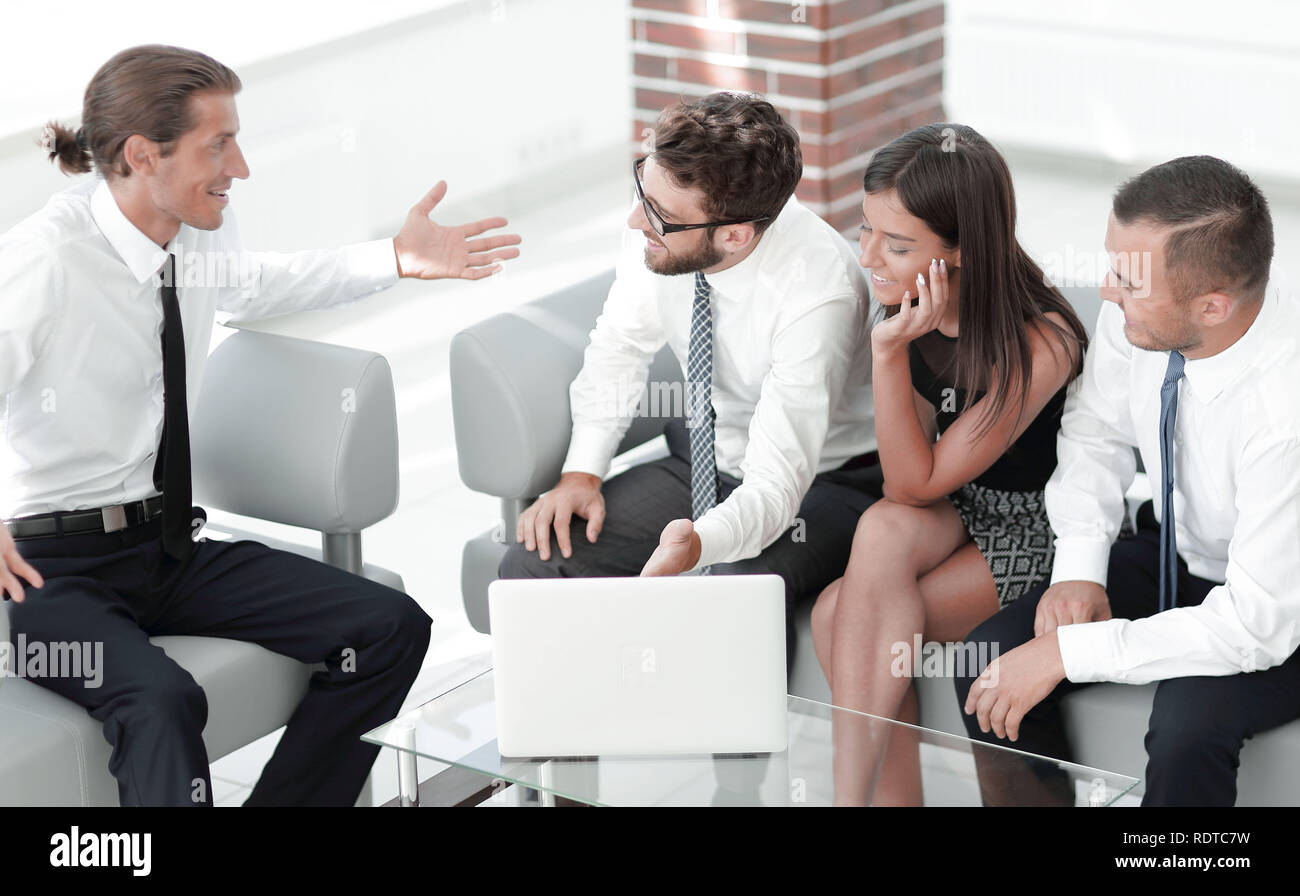 Manager and business team discussing business issues,sitting in the ...