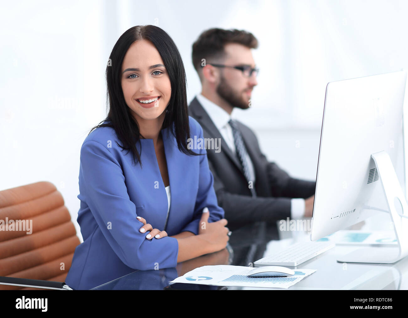 Business partners at work in front of desktop Stock Photo - Alamy