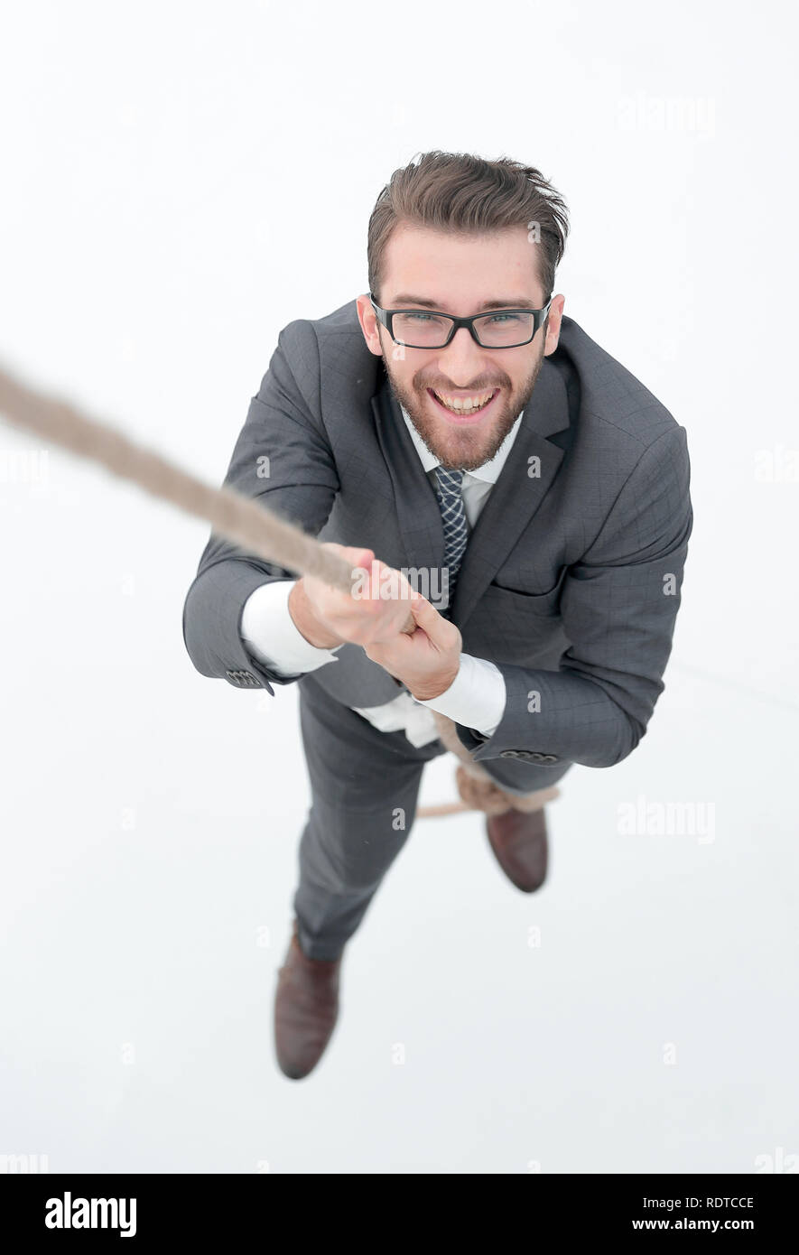 top view .a successful businessman climbing the rope.photo with copy ...