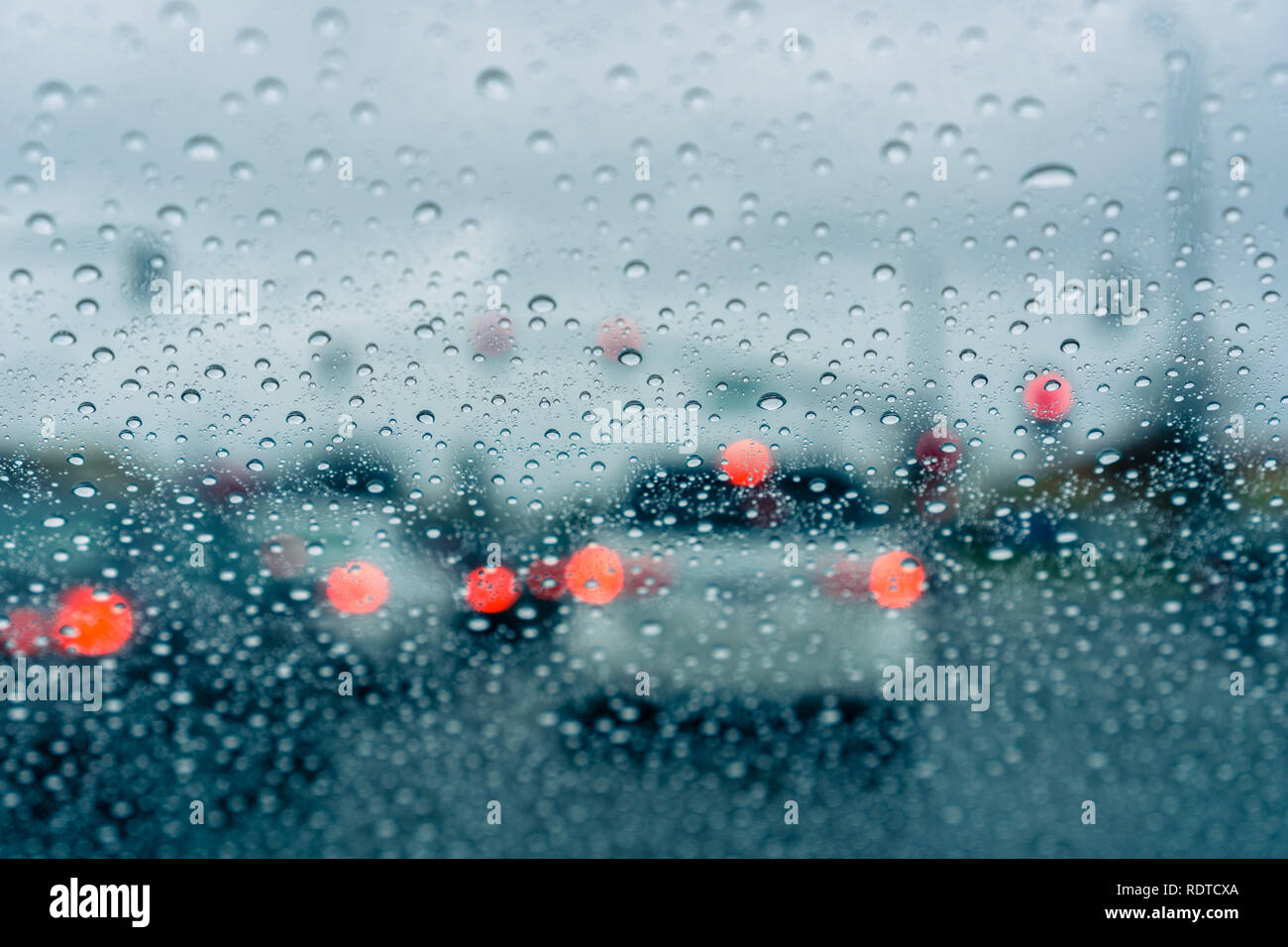 Heavy traffic during a rainy day; raindrops on the window Stock Photo ...