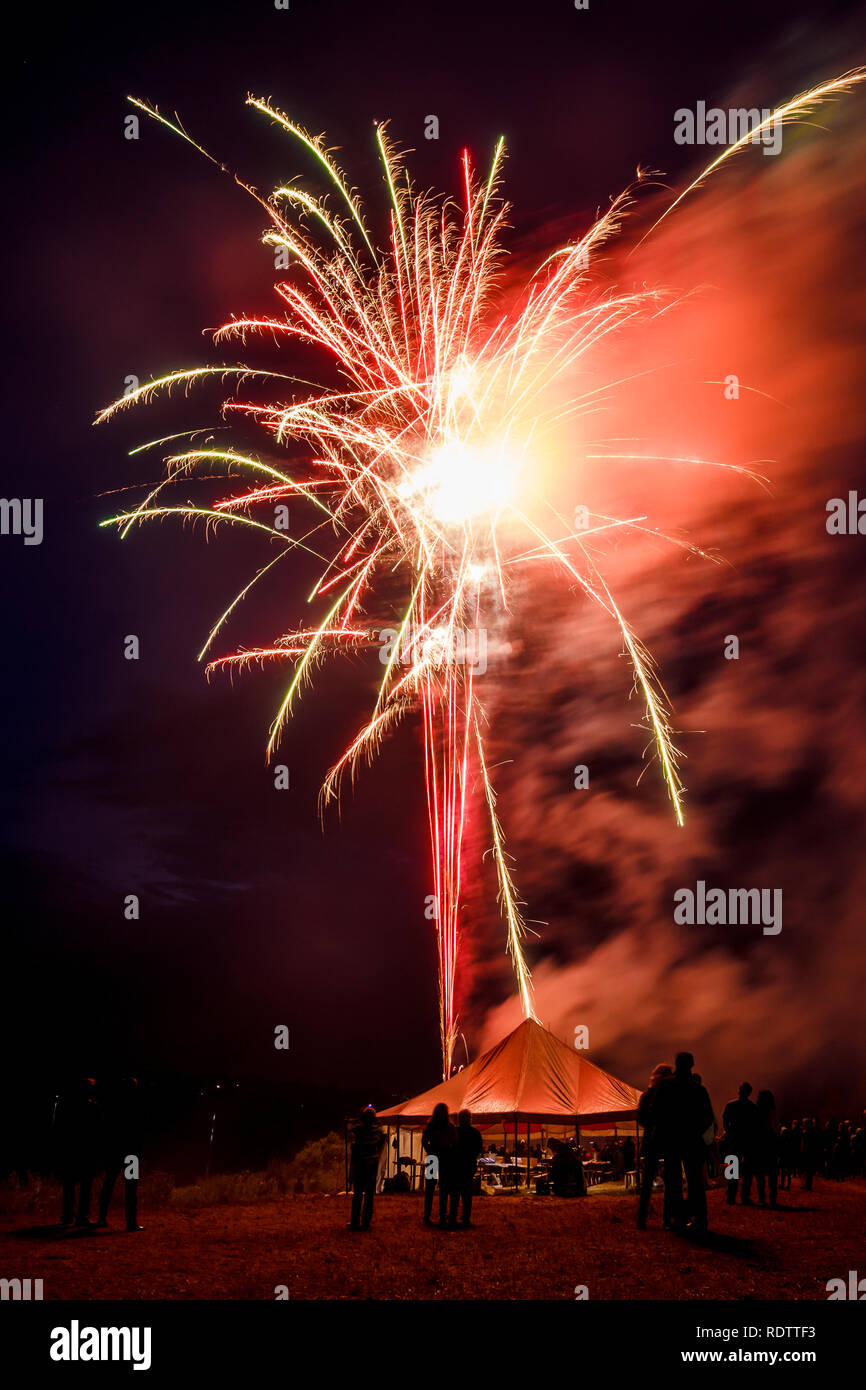 populous festive fireworks outside the city in the summer camp under ...
