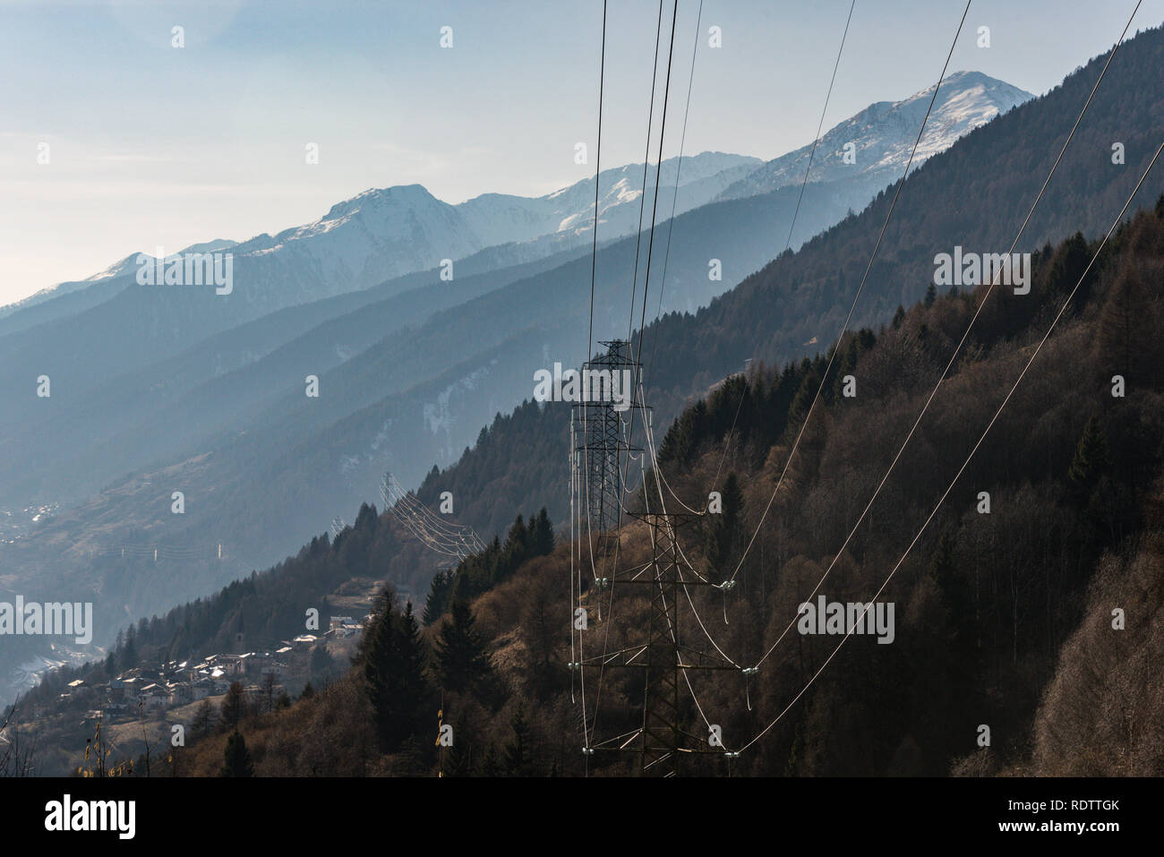 Alps landscape and high voltage power lines on electricity pylons in ...