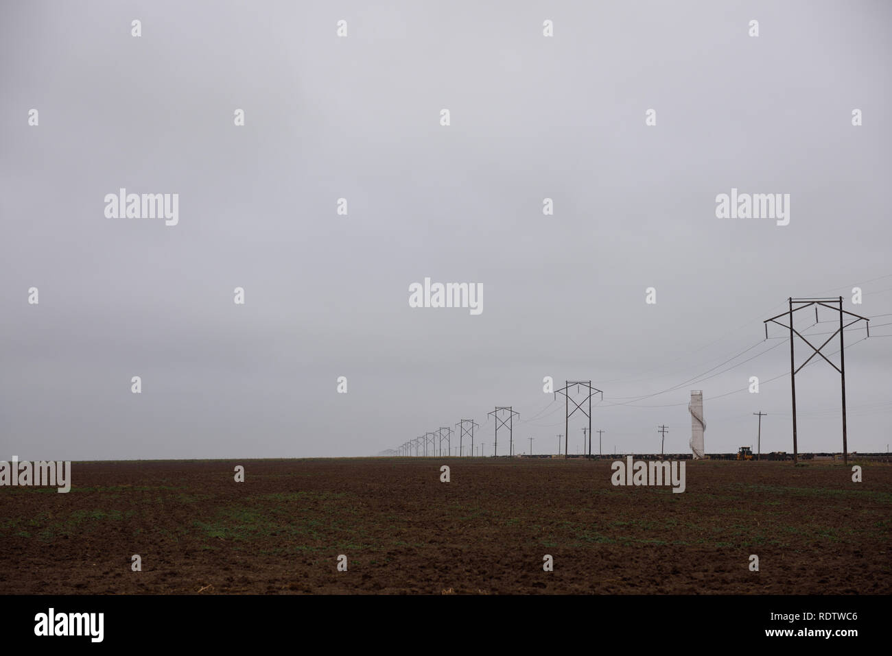 Electricity Pylons In Countryside Farm Field High Resolution Stock ...