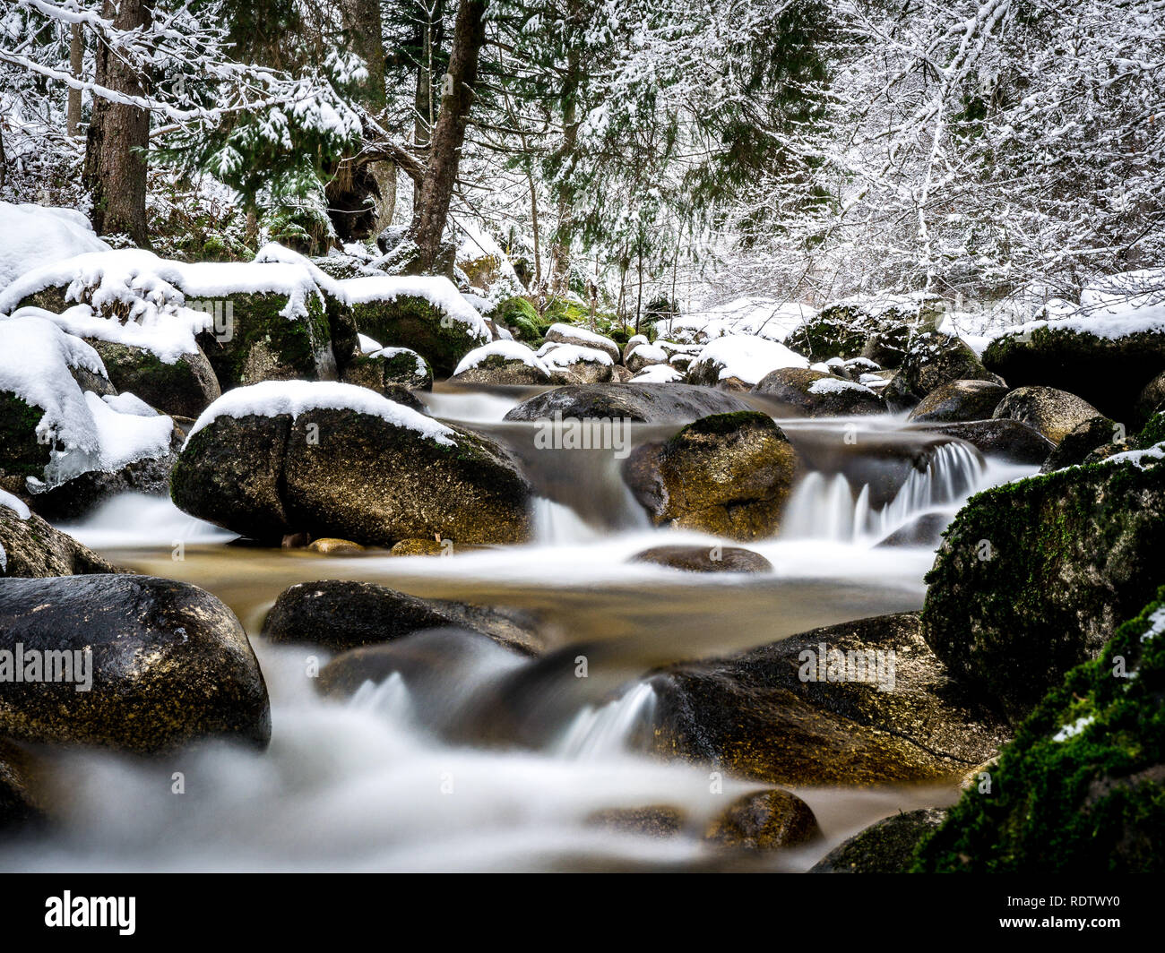 Long exposure shot of a little stream in winter Stock Photo - Alamy