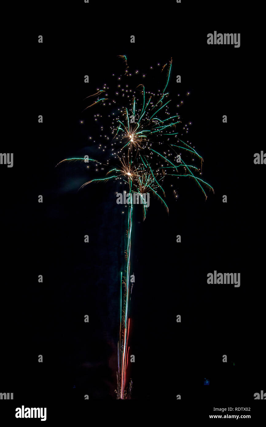 populous festive fireworks outside the city in the summer camp under ...