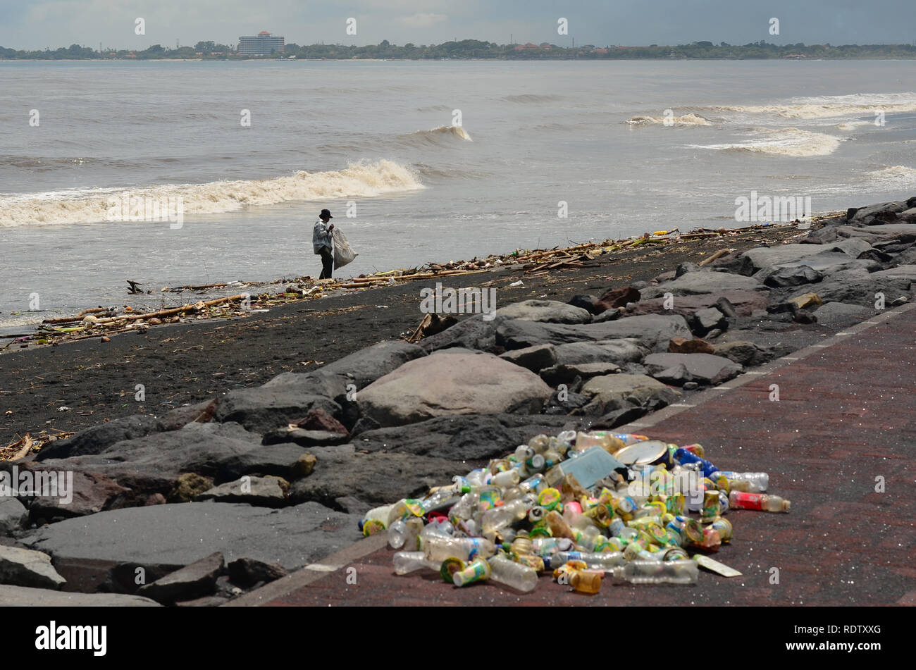 People Collects Plastic Bottles on The Polluted Coast Stock Photo - Alamy