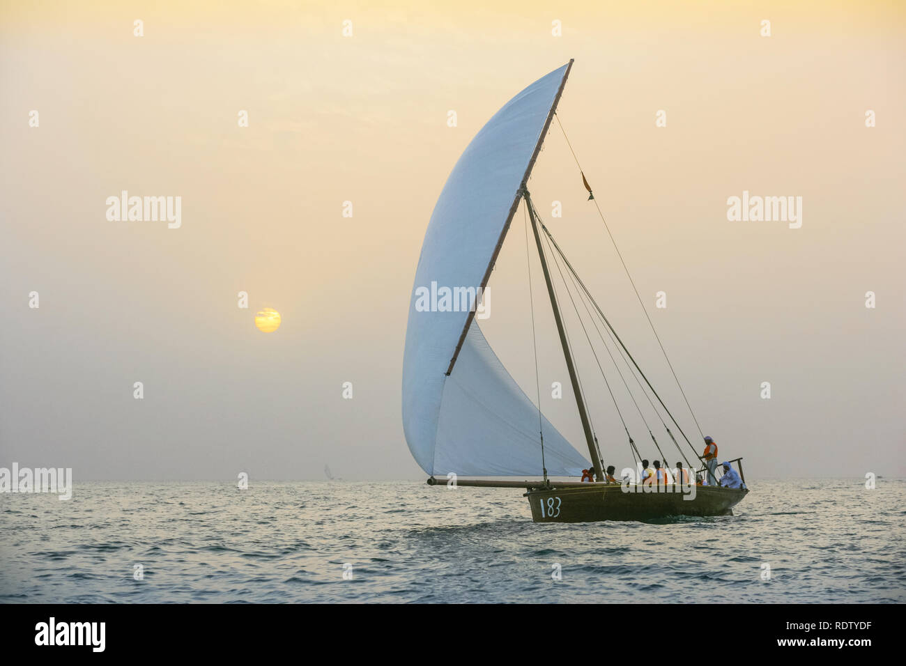 A traditional racing dhow approaching the finishing line off Dubai at ...
