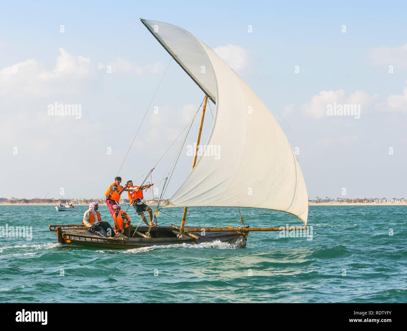 A small traditional dhow sailing off Dubai in the United Arab Emirates ...