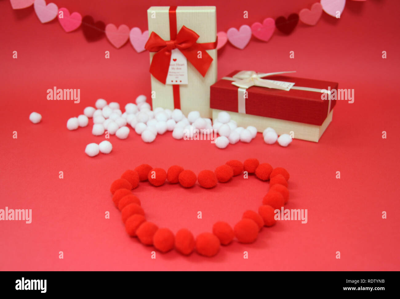 Gift box with red theme Stock Photo - Alamy