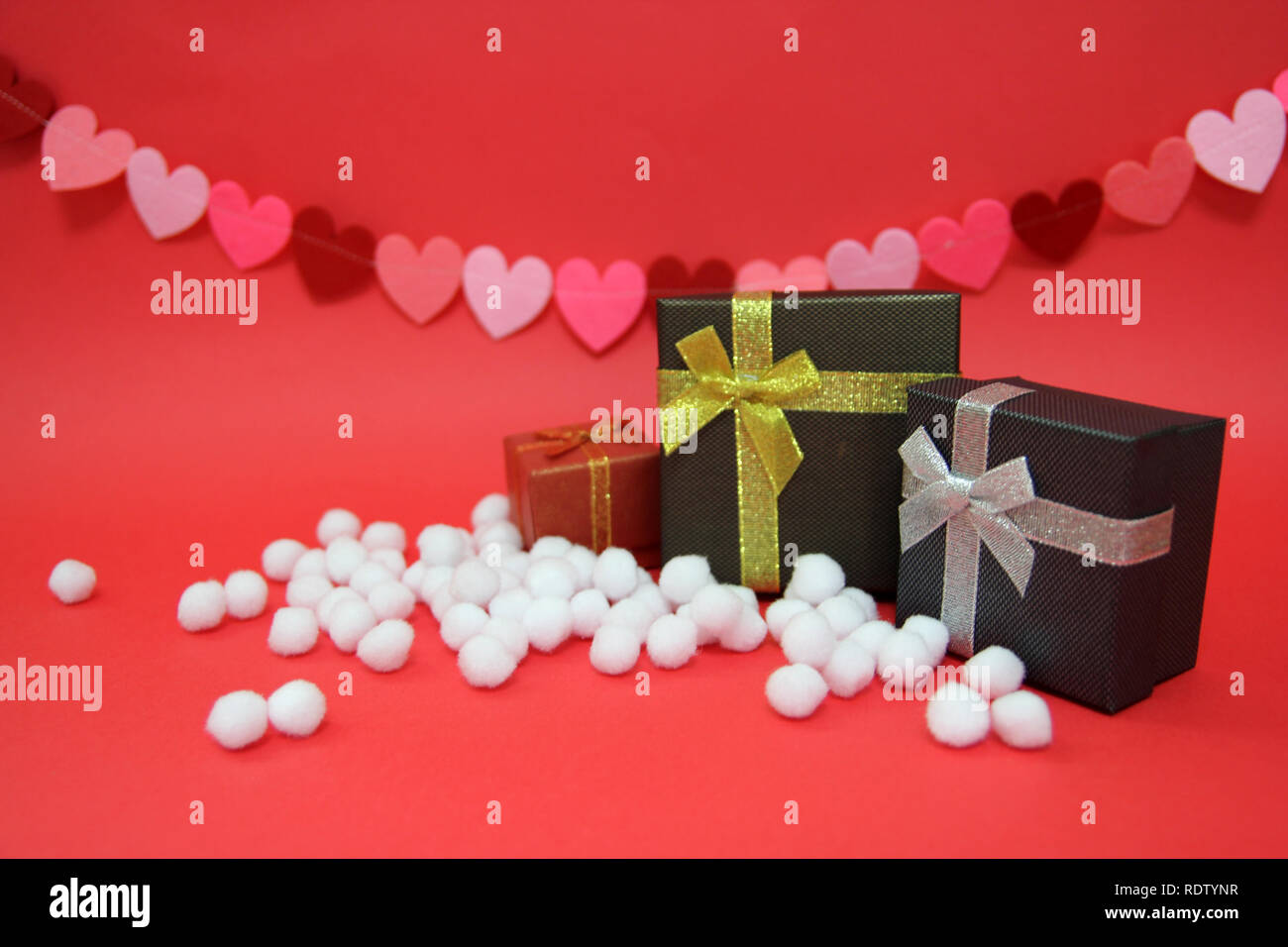 Gift box with red theme Stock Photo - Alamy