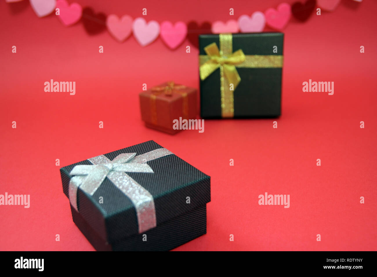 Gift box with red theme Stock Photo - Alamy