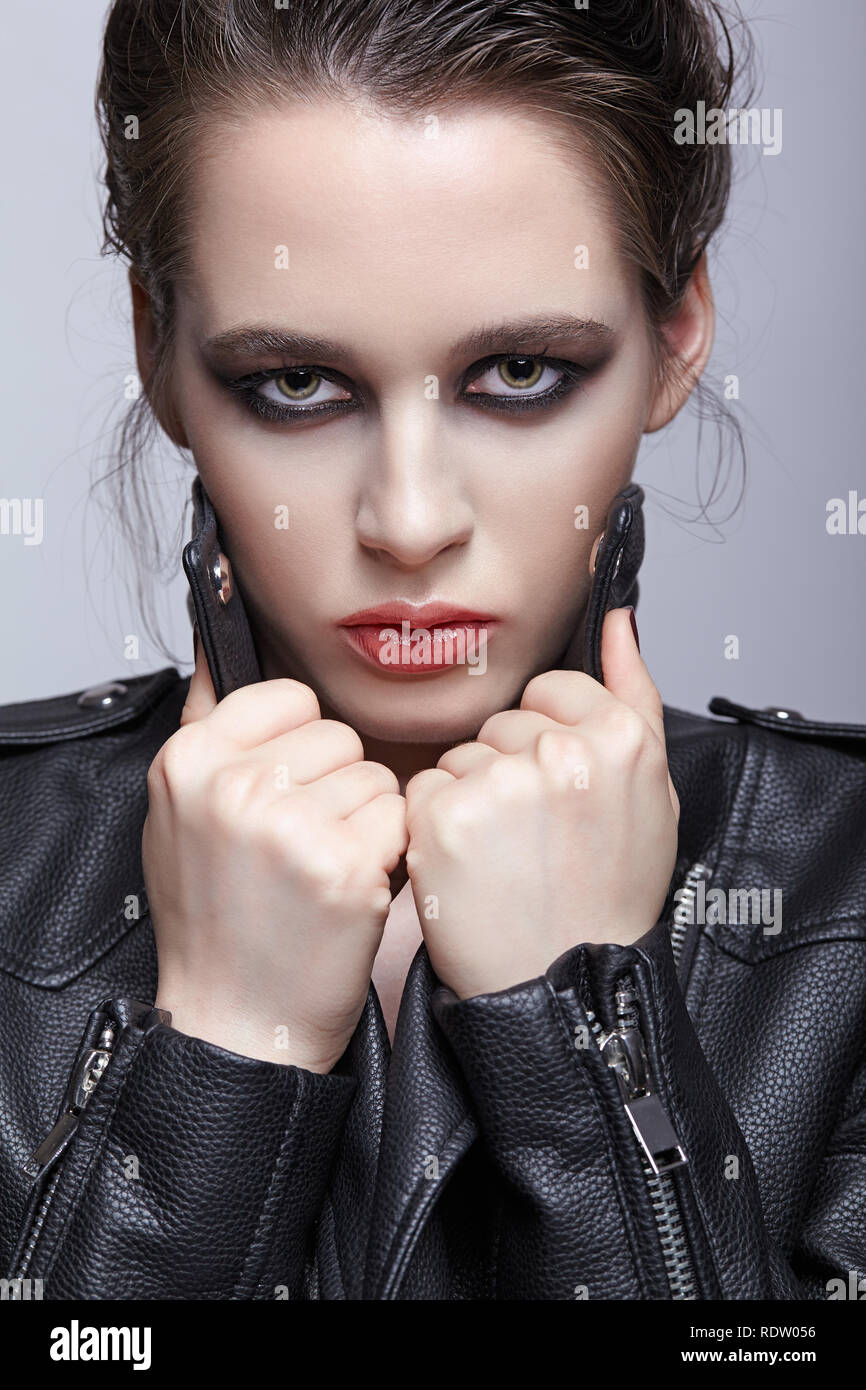 Portrait of female in black leather jacket. Woman with unusual beauty ...