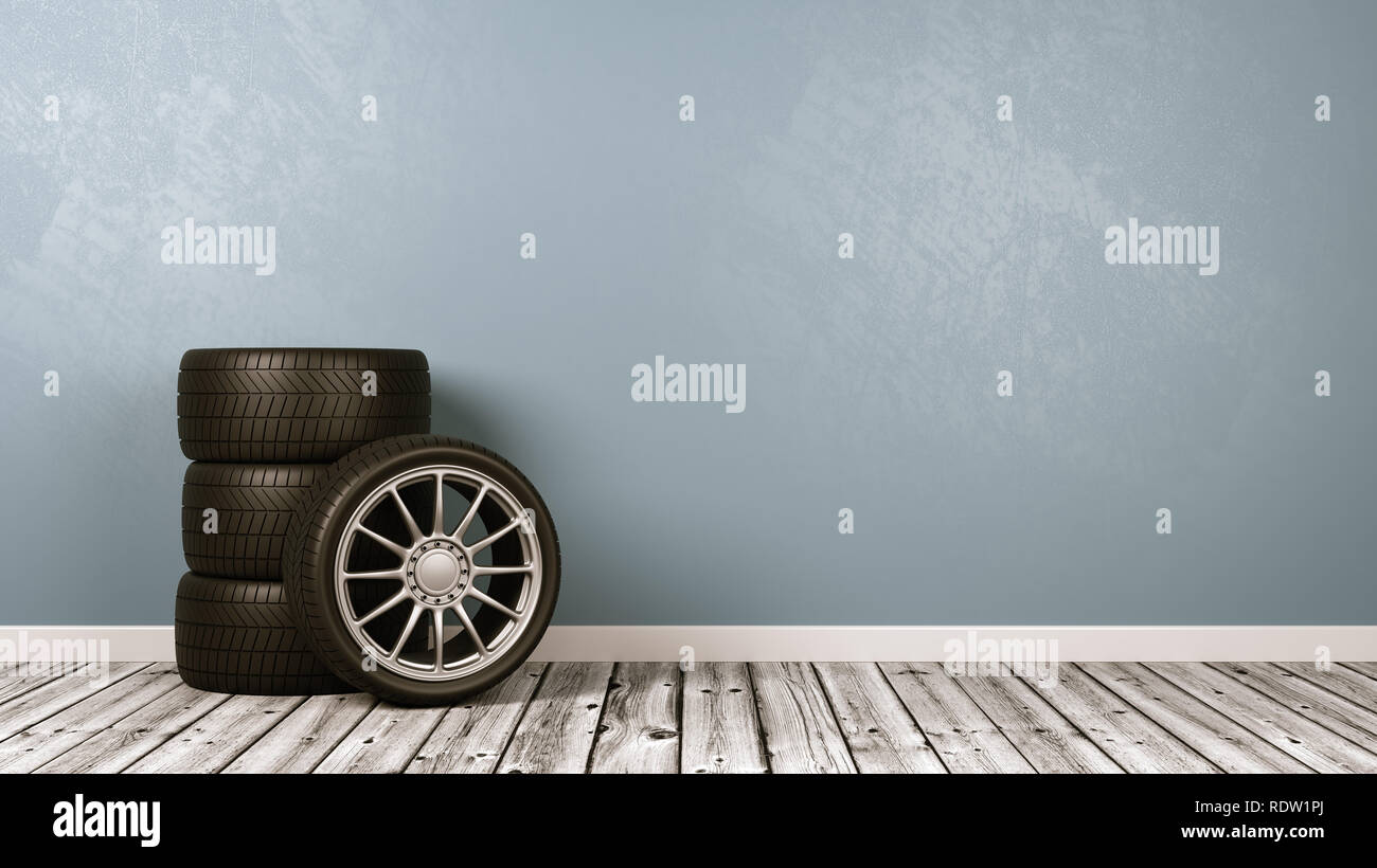 Four Car Wheels on Wooden Floor Against Blue Gray Wall with Copy Space ...