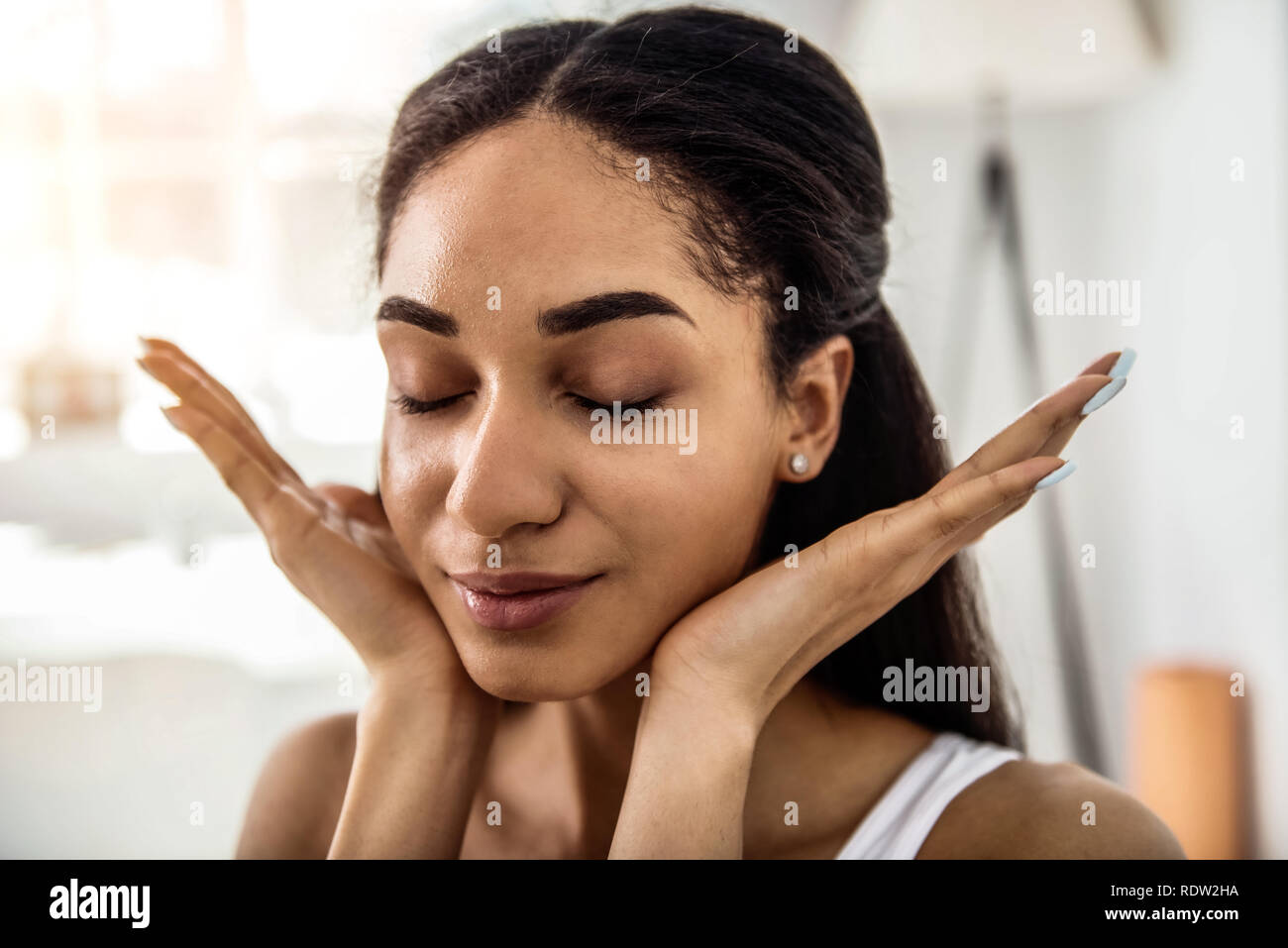 Delighted brunette female person demonstrating her face Stock Photo - Alamy