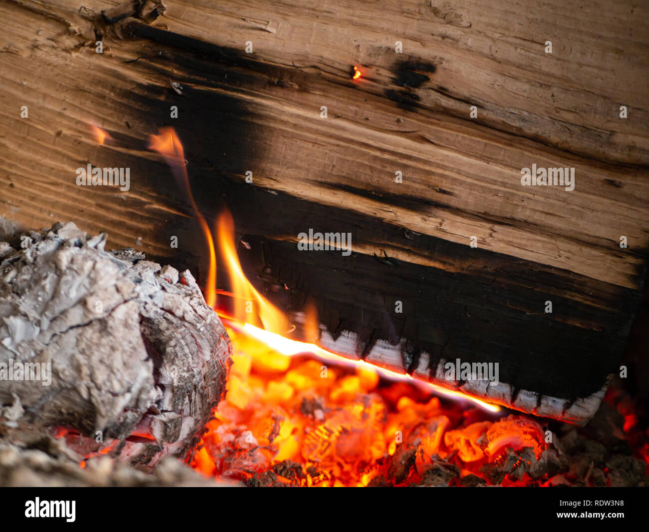Close-up shot of a log of wood in an oven Stock Photo - Alamy